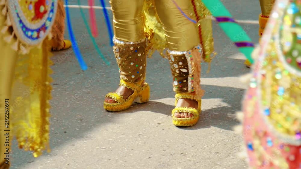 Carnival dancer feet and legs marching on parade route, slow motion ...