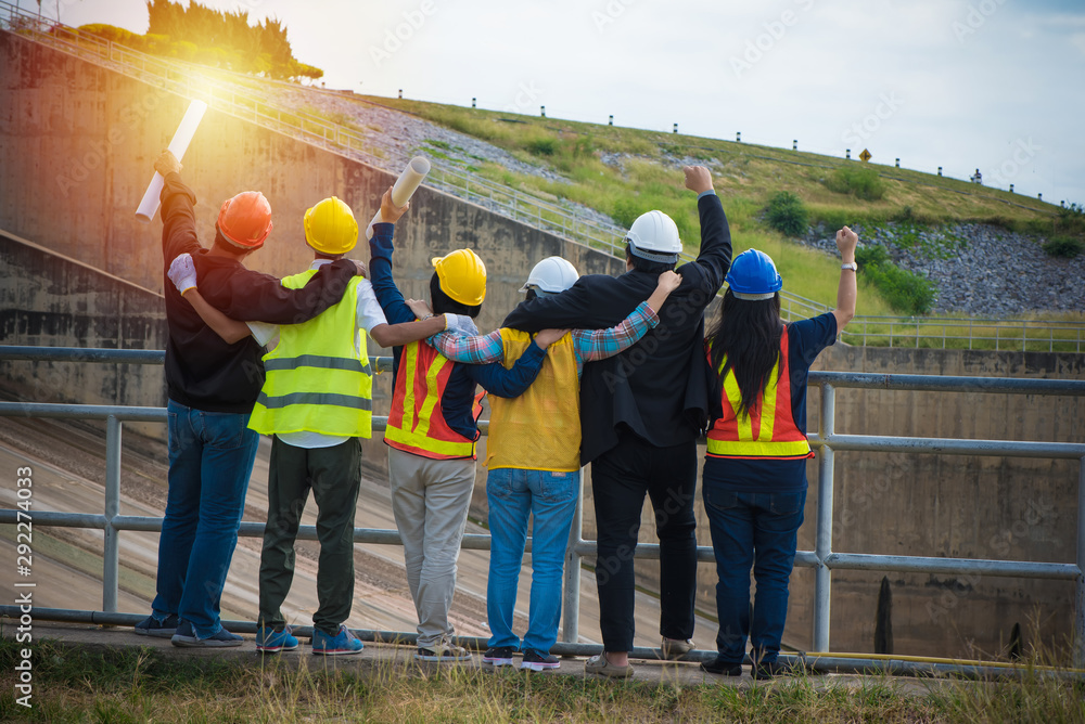 Happy successful multiracial Engineering team showing unity, Teamwork ...