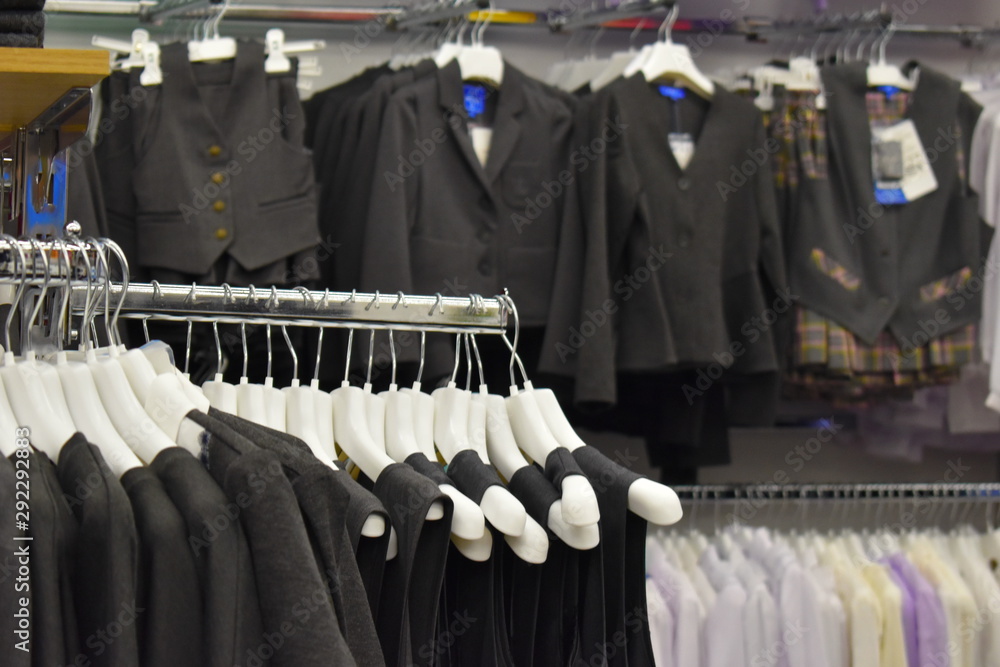 School uniform in a clothing store. Stock Photo | Adobe Stock