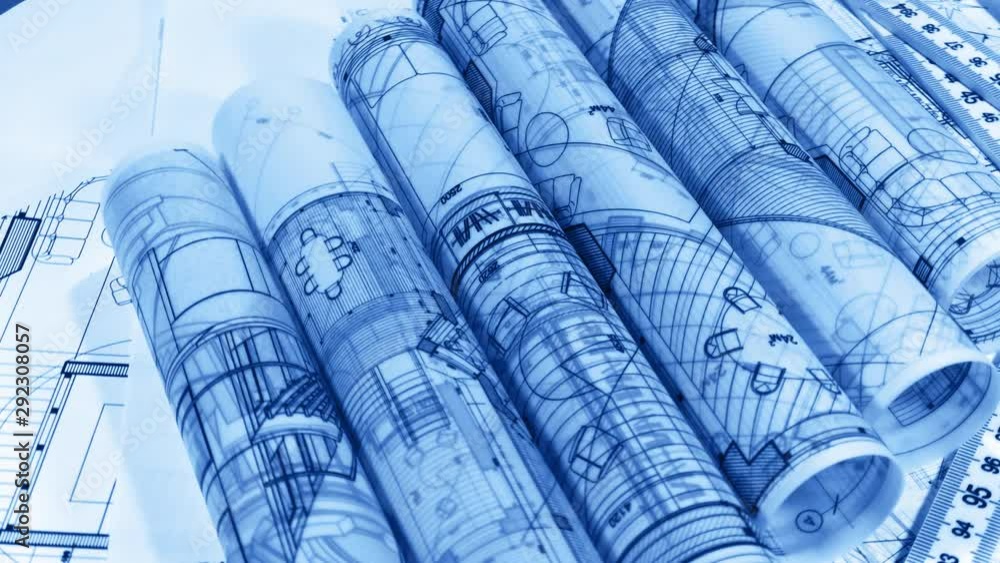 Blueprints - rolls of architectural drawings smoothly rotate on the ...