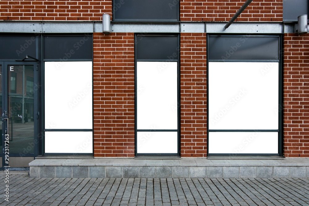 six billboards in a shop window against the background of glass and a ...