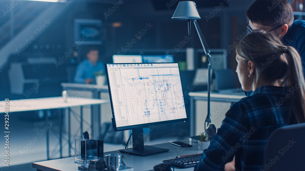 Engineer Working on Desktop Computer, Screen Showing CAD Software with ...