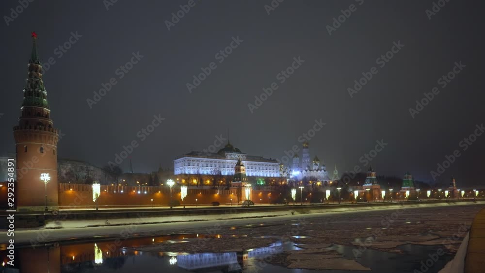 Kremlin wall. Tower with a red star on top. Moscow river is partially ...