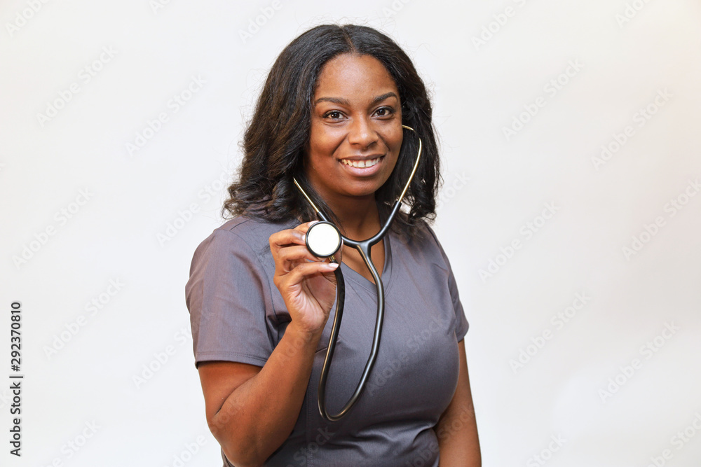 Portrait of an attractive female healthcare professional against a ...