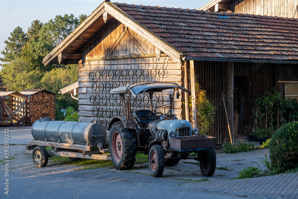 Alter Trecker mit Guellefass als Viehstraenke Stock Photo | Adobe Stock
