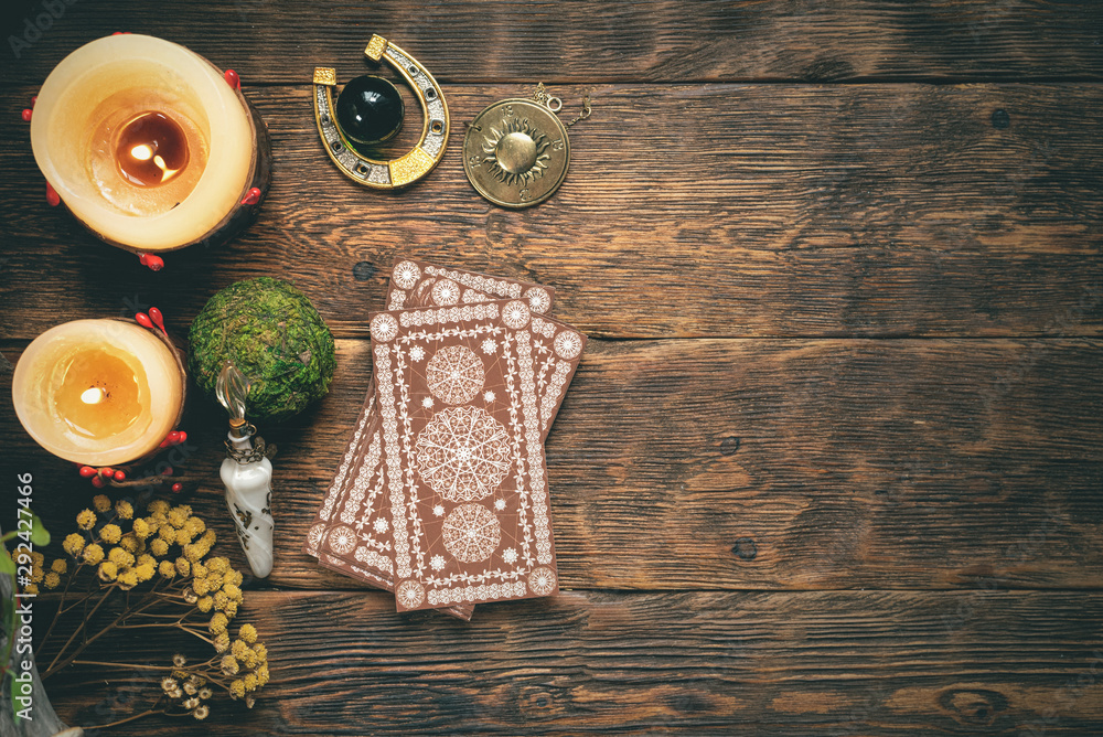 Fortune teller woman reading a future by tarot cards on her table with ...
