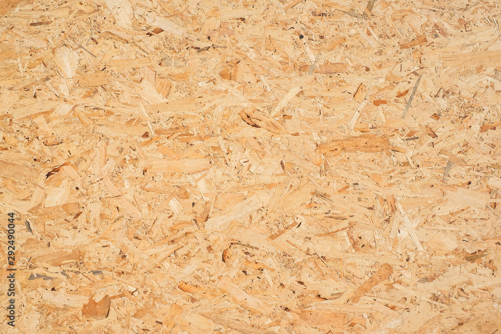 OSB boards are made of brown wood chips sanded into a wooden background ...