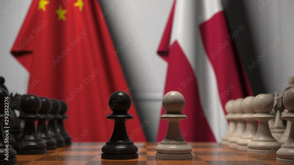 Flags of China and Denmark behind pawns on the chessboard. Chess game ...