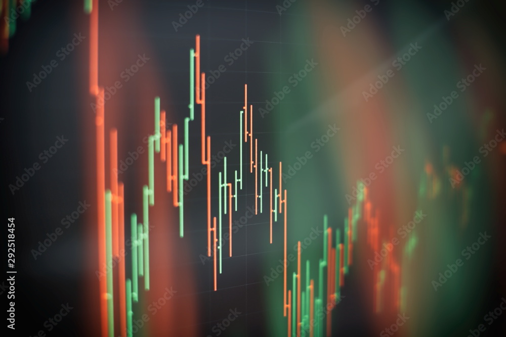Business analyzing financial statistics displayed on the tablet screen ...