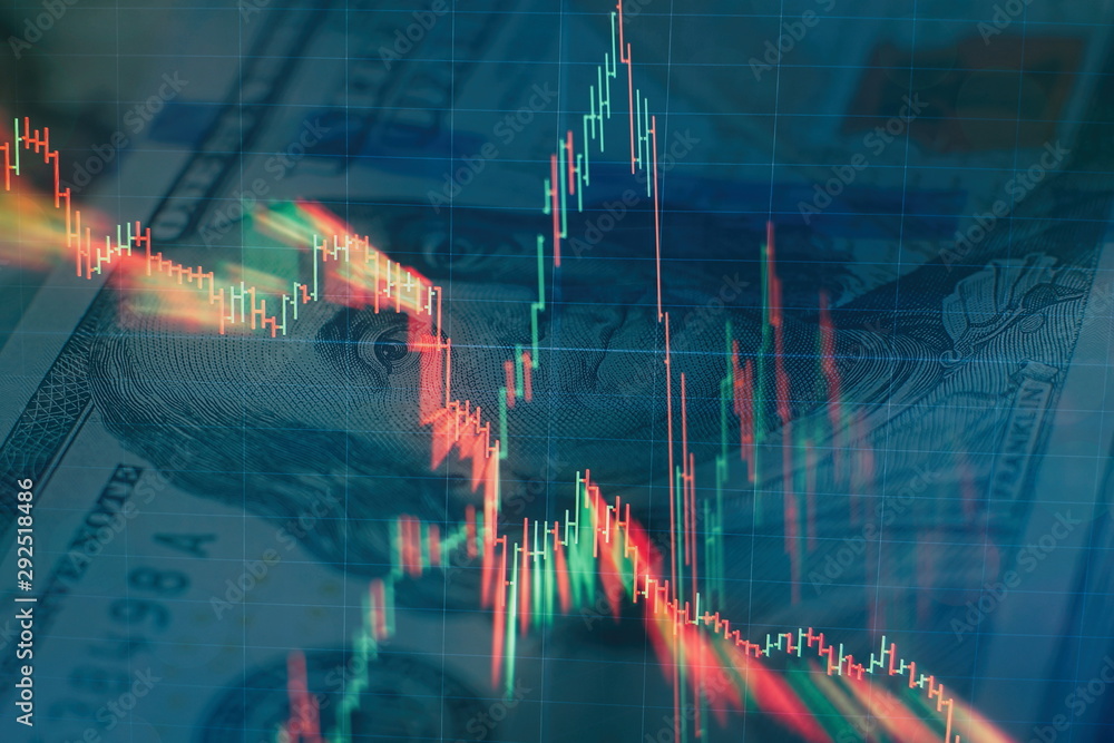 Business analyzing financial statistics displayed on the tablet screen ...