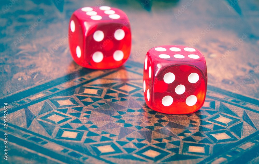 Backgammon. Board game. White cubes and chips on a blackboard. Stock ...