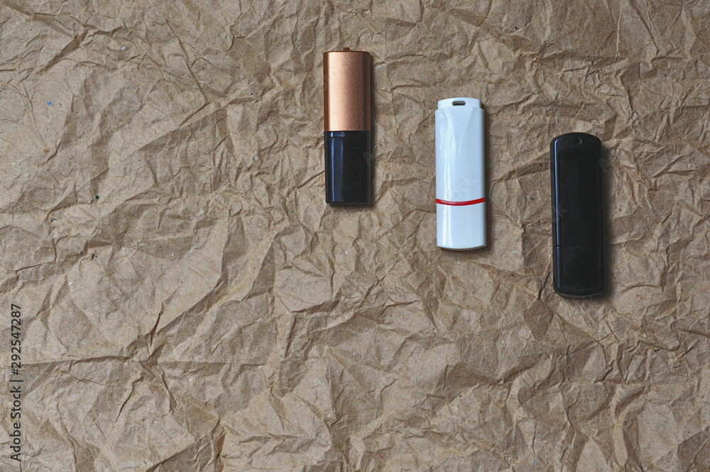 Three usb flash drives, white, black and bronze are in different ...