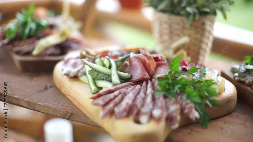 Different types of meat are on the plate.Buffet table. A lot of snacks ...