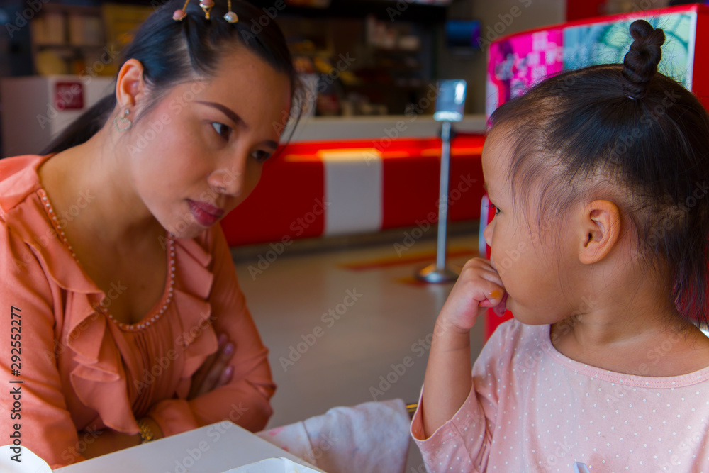 Angry mom with her child, looking her daughter and complaining. Stock ...