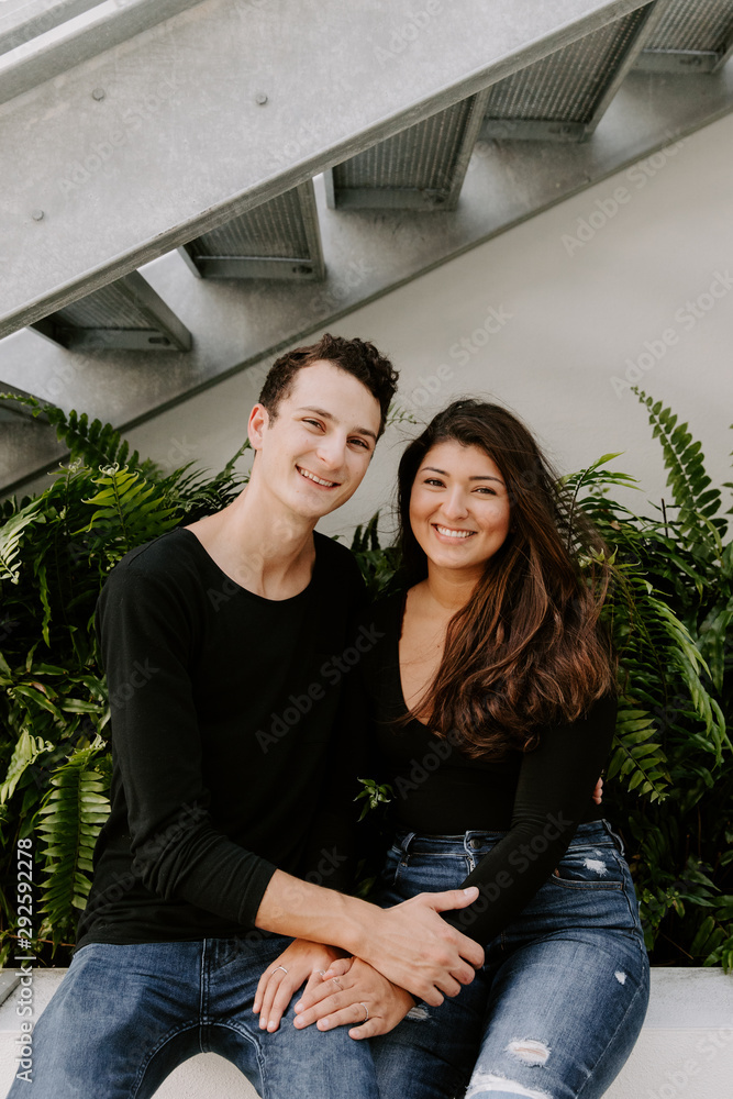Cute Young Couple in Love Sitting in Front of Urban Concrete Stairs and ...