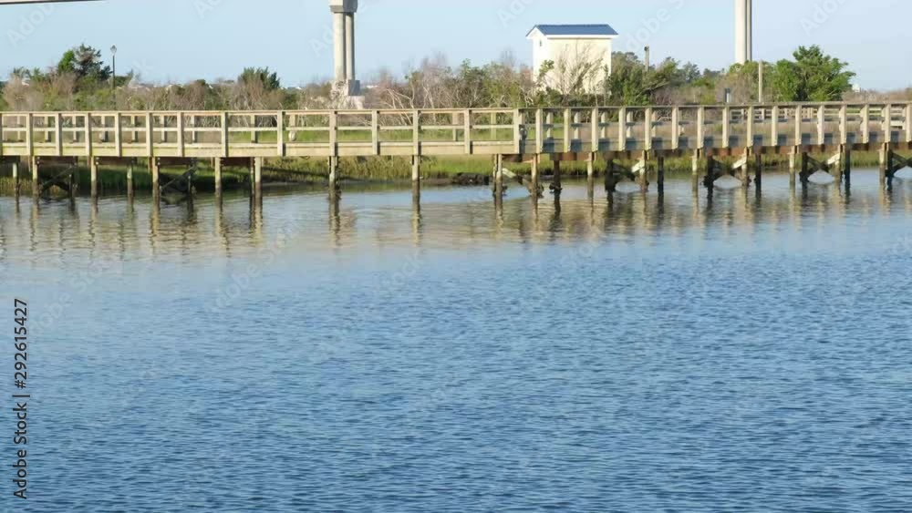 Boardwalk and nature trail in Topsail Beach, at an inlet separating ...