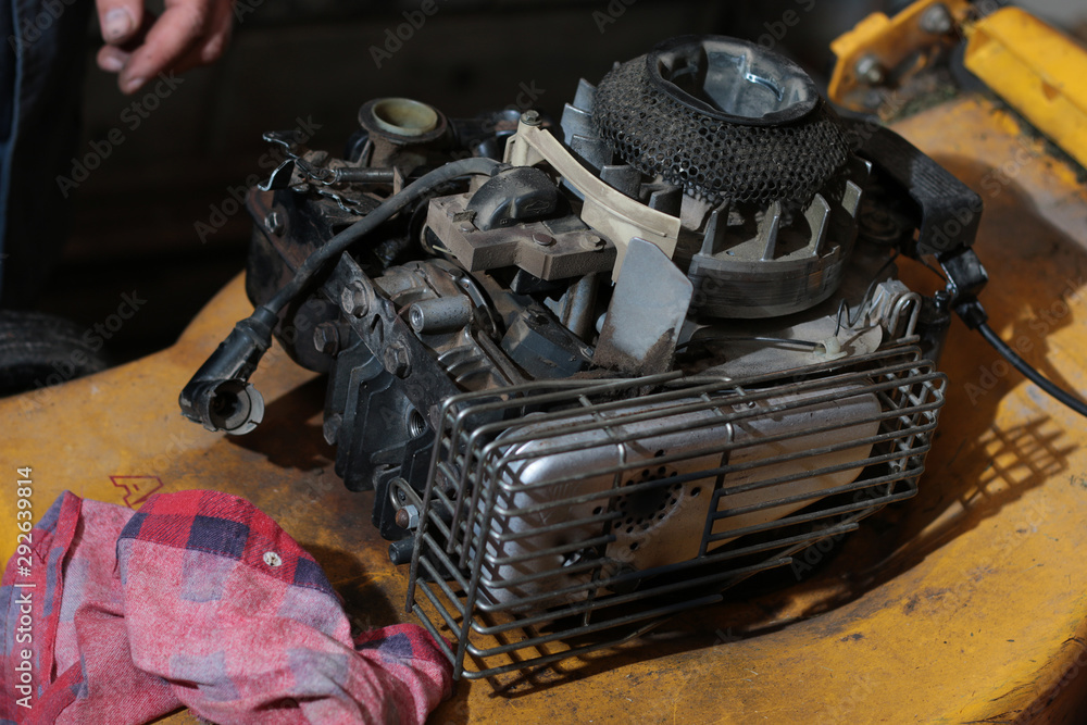 repairing lawn mower engine Stock Photo | Adobe Stock