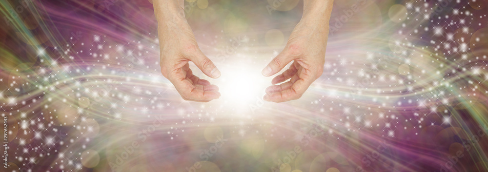 Energy Lightworker Sensing white light - female hands facing each with ...