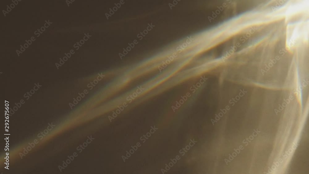 Glares of the sun on the right top corner of light wall. Sun beams ...