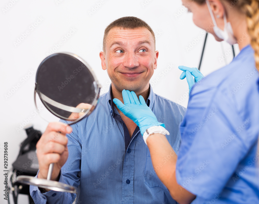 Female doctor is preparing client to procedure Stock Photo | Adobe Stock