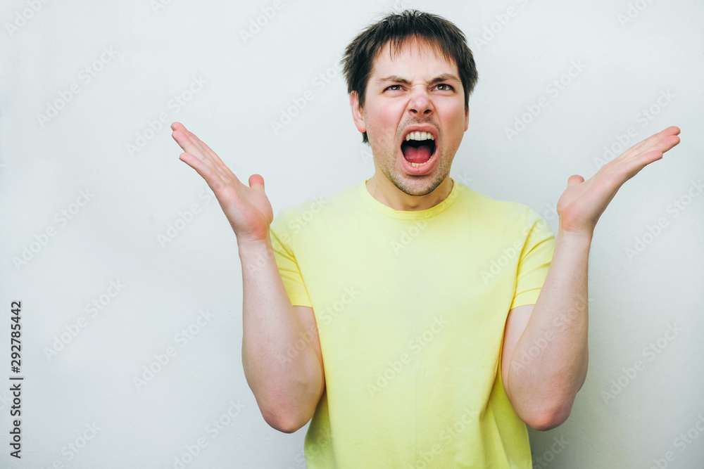 Angry mad outraged stressed young men yelling shouting loud, with ...