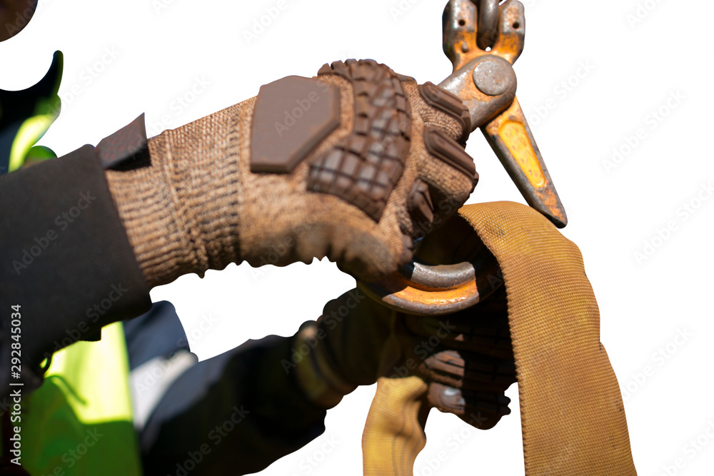 Rigger high risk worker wearing heavy duty glove and clipping a safety ...