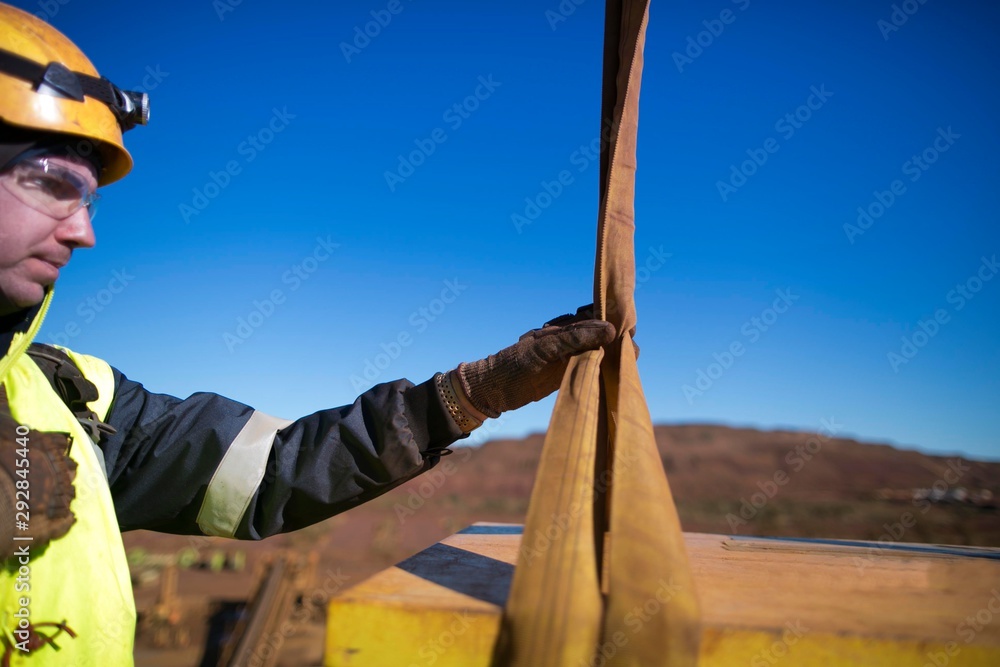 Rigger is communicating on radio with crane driver while his hand ...