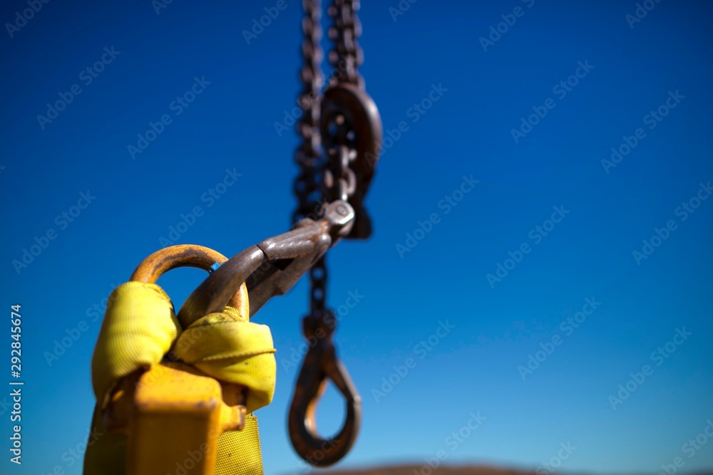Isolated 3 tone safety crane chain hook connecting attached into ...