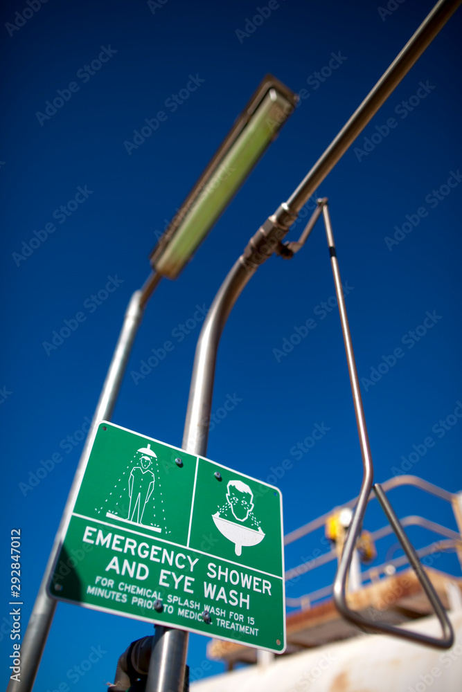 Fotka „Industrial emergency safety shower sign station at construction ...