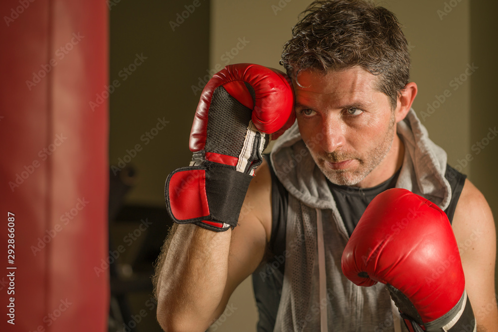 gym workout portrait of attractive and fierce looking boxer man 30s to ...