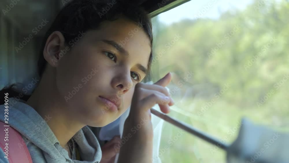 sad girl lifestyle looks out the train window. travel transportation ...