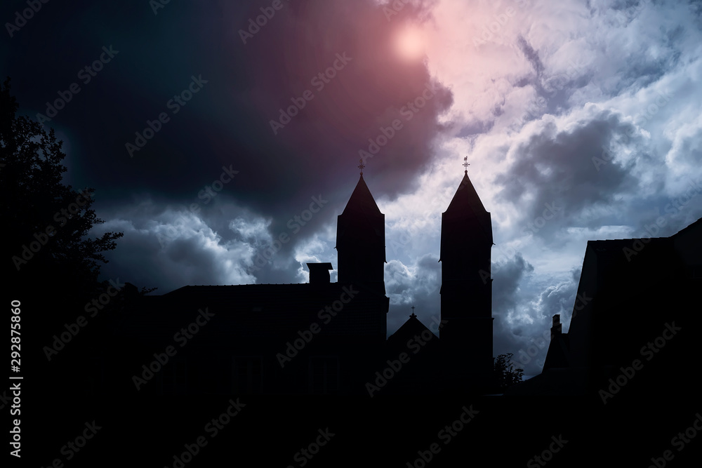 Silhouette of medieval castle and the cathedral church, night over dark ...