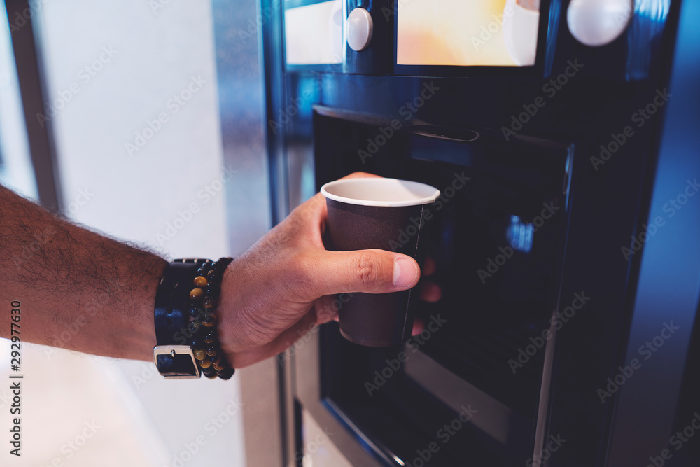 Man hand with coffee, vending coffee machine Stock Photo | Adobe Stock
