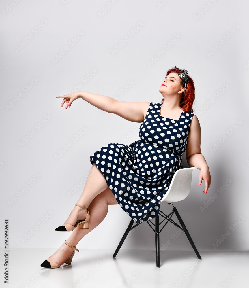 Pin up a female portrait. Beautiful retro fat woman in polka dot dress ...
