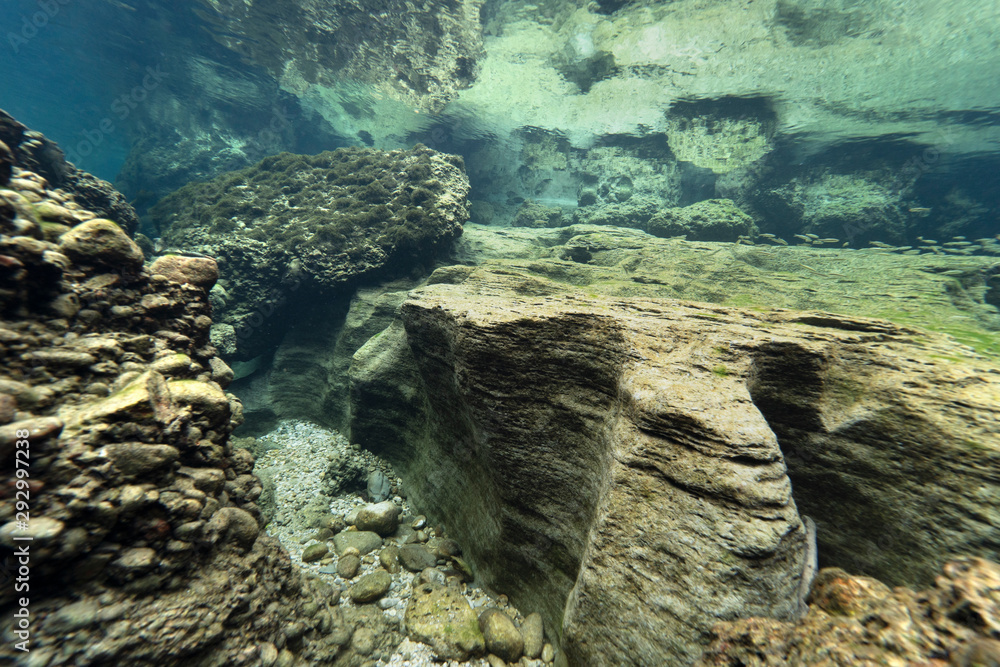 Rocks underwater on riverbed with clear freshwater. Underwater ...