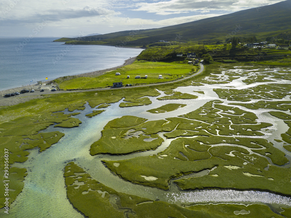 High altitude view of green river delta and ocean coastline in Ireland ...