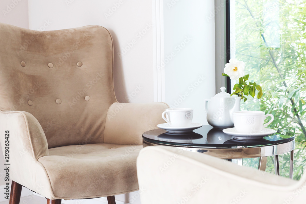 Two cups and tea cattle on a table. Stock Photo | Adobe Stock