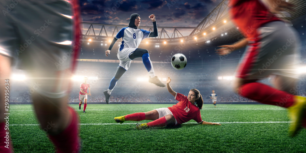 Female muslim soccer player in hijab shows exciting play during the ...