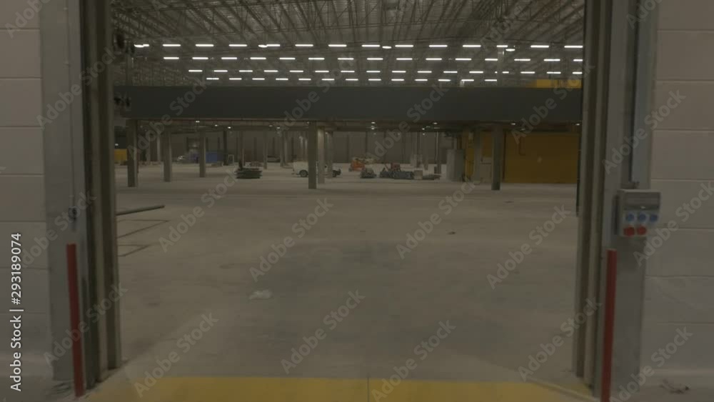 Interior clip of a production hall under construction. The camera is ...