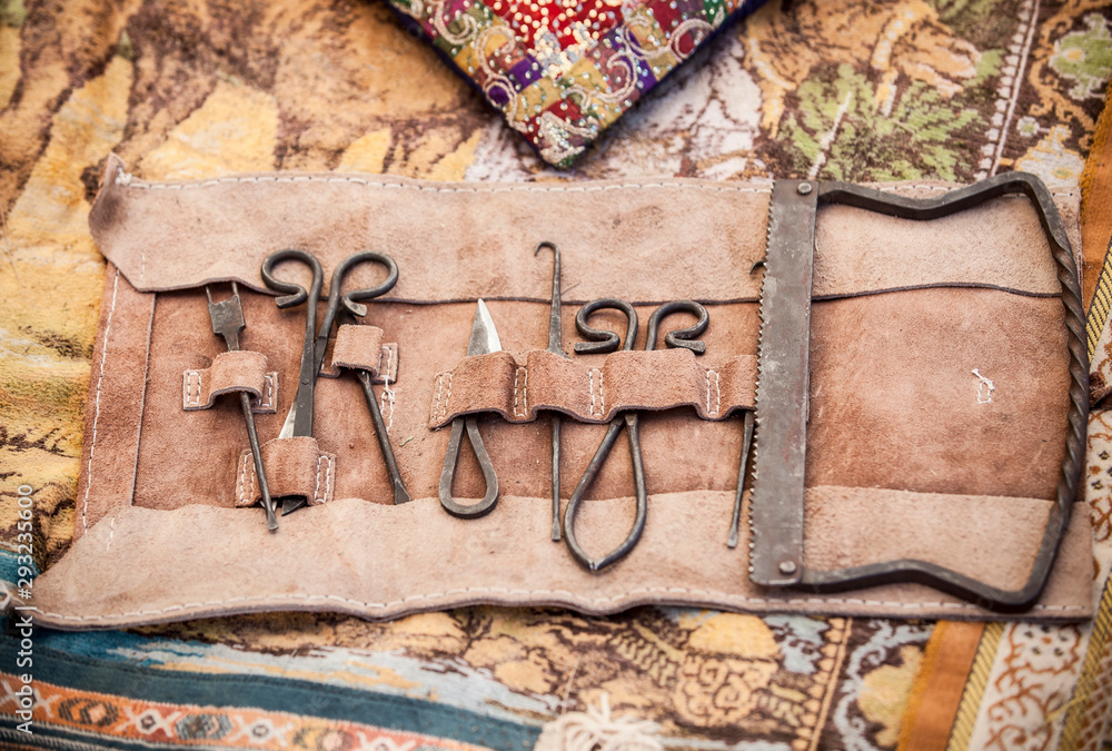 Medieval surgery doctors tools in leather wrap Stock Photo | Adobe Stock