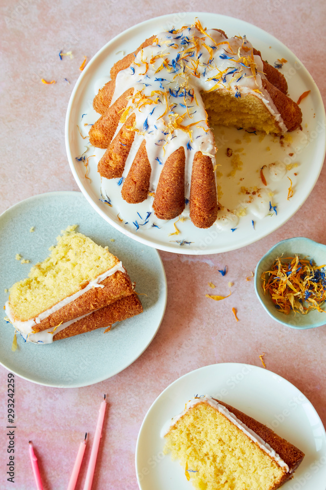 Lemon Drizzle Birthday Cake with Icing and Edible Flowers Stock Photo ...