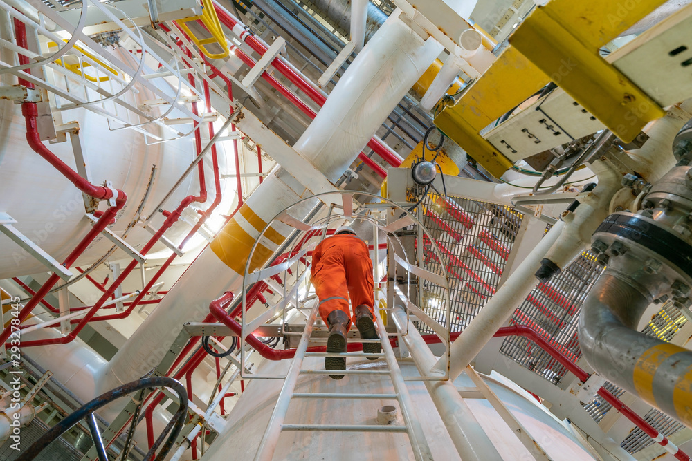 Production operator working at offshore oil and gas central processing ...