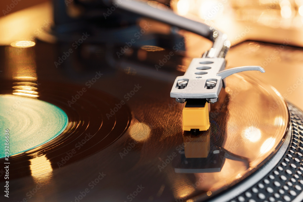 Poster Turntable player with background of a stack of audition records ...