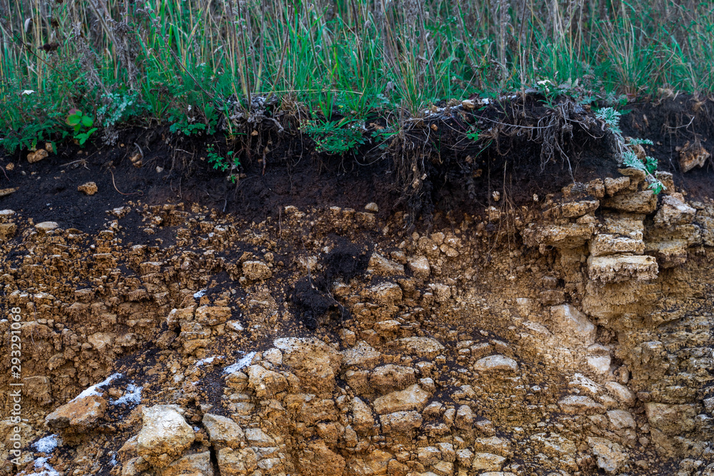 Soil cut-sandstone, stones, clay, sand structure and layers. slice of ...
