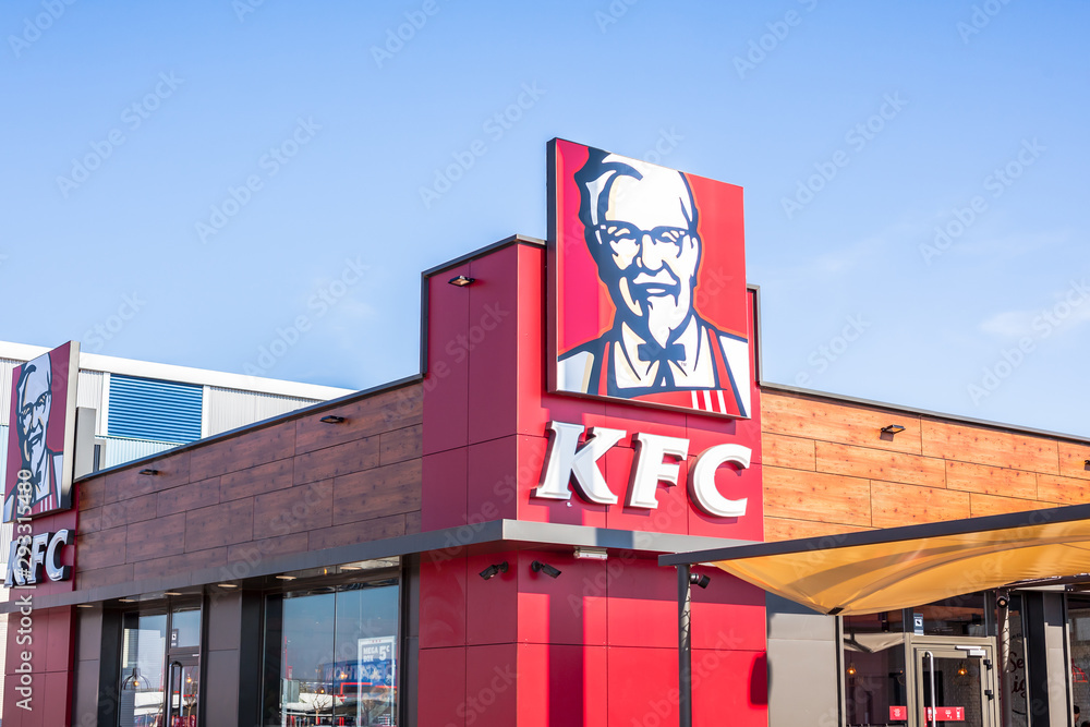 KFC fast food restaurant logo at its building Stock Photo | Adobe Stock