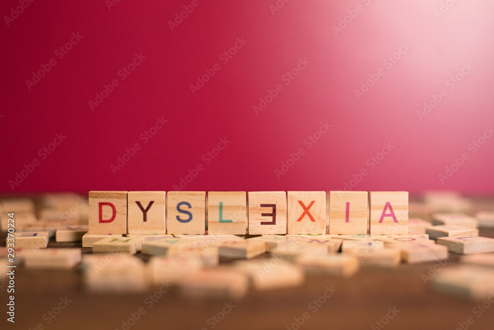 Poster wooden alphabet blocks with DYSLEXIA word in the center on ...