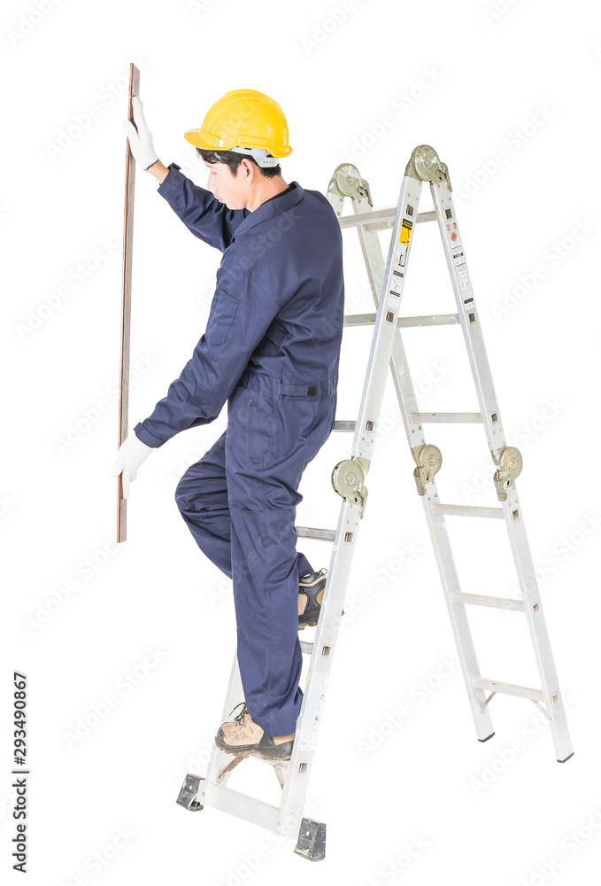 Handyman in uniform standing on ladder holding wood plank on white ...