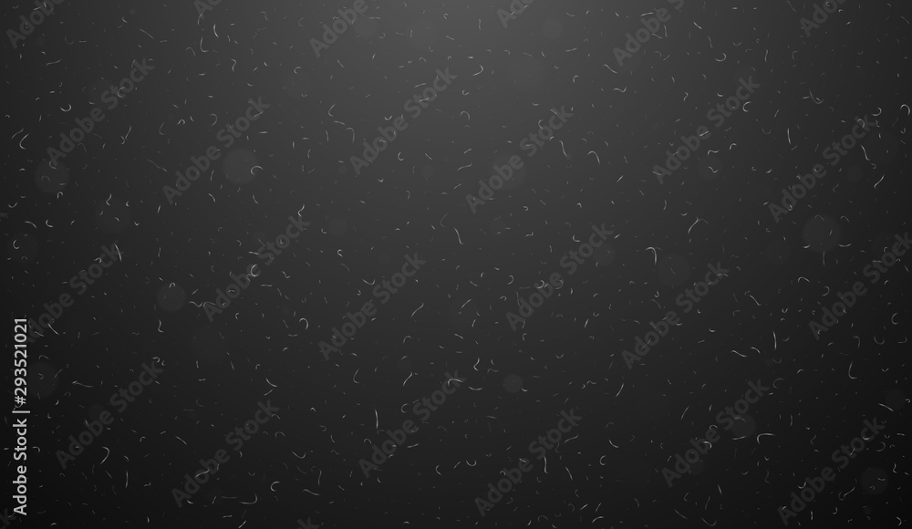 Macro dust particles flying over black background. Abstract white dust ...
