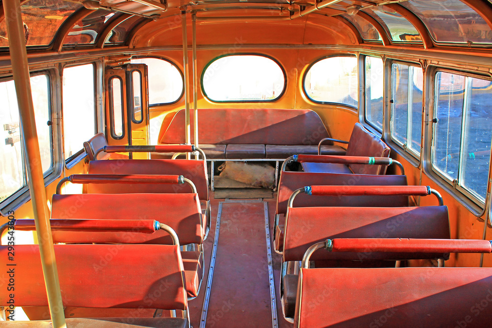 old yellow bus in vintage style on a yellow background. Urban transport ...