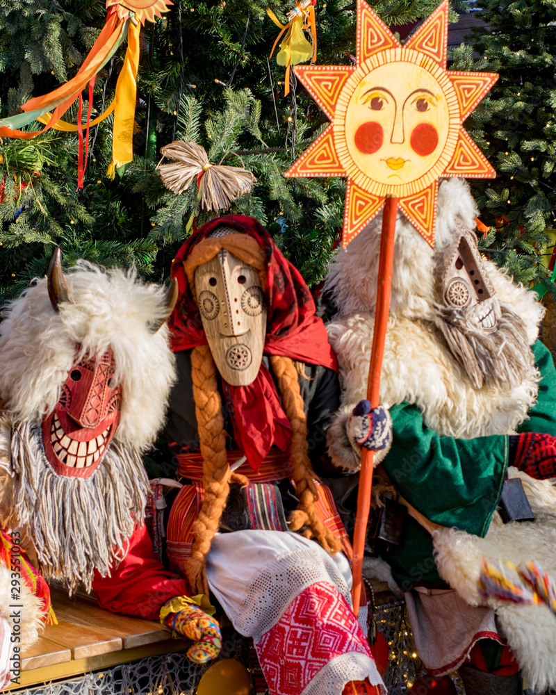 Three actors representing pagan idols and symbols of Shrovetide posing ...